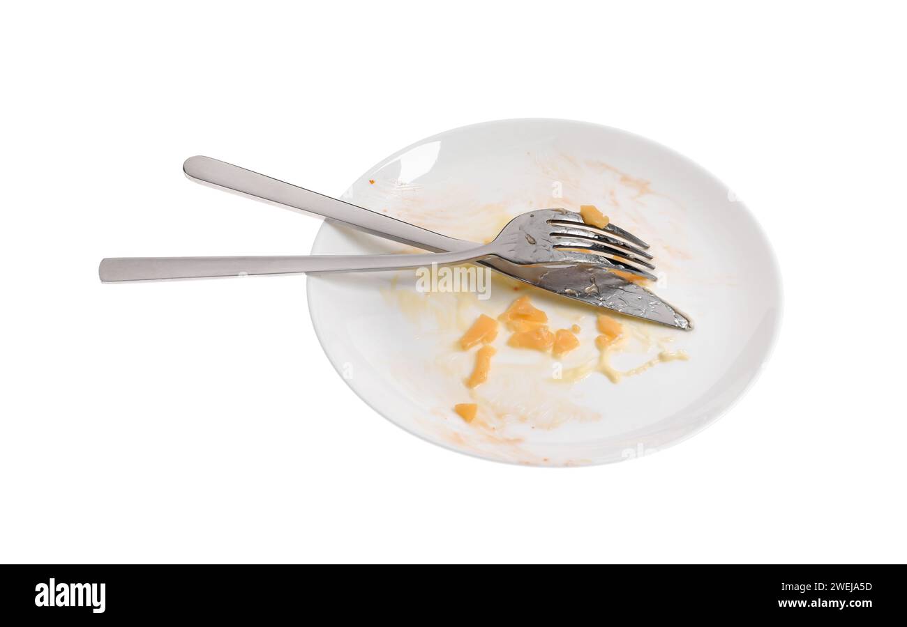 Dirty plate and cutlery on white background Stock Photo - Alamy