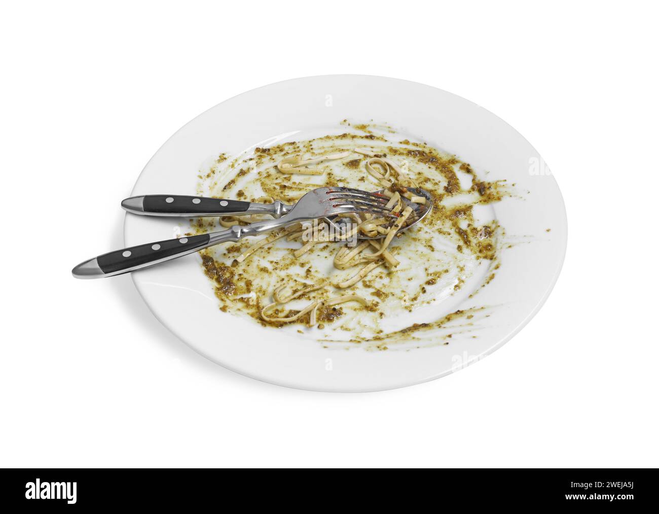 Dirty plate and cutlery on white background Stock Photo - Alamy