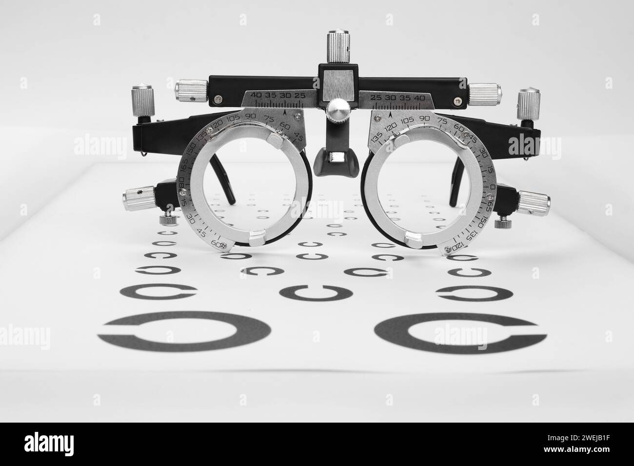 Trial frame and vision test chart isolated on white Stock Photo - Alamy