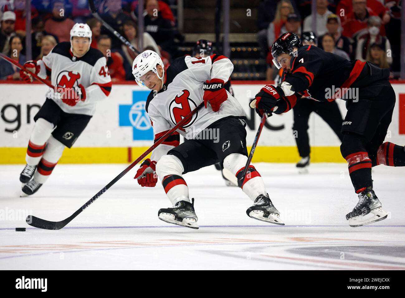 New Jersey Devils' Nathan Bastian (14) controls the puck in front of ...