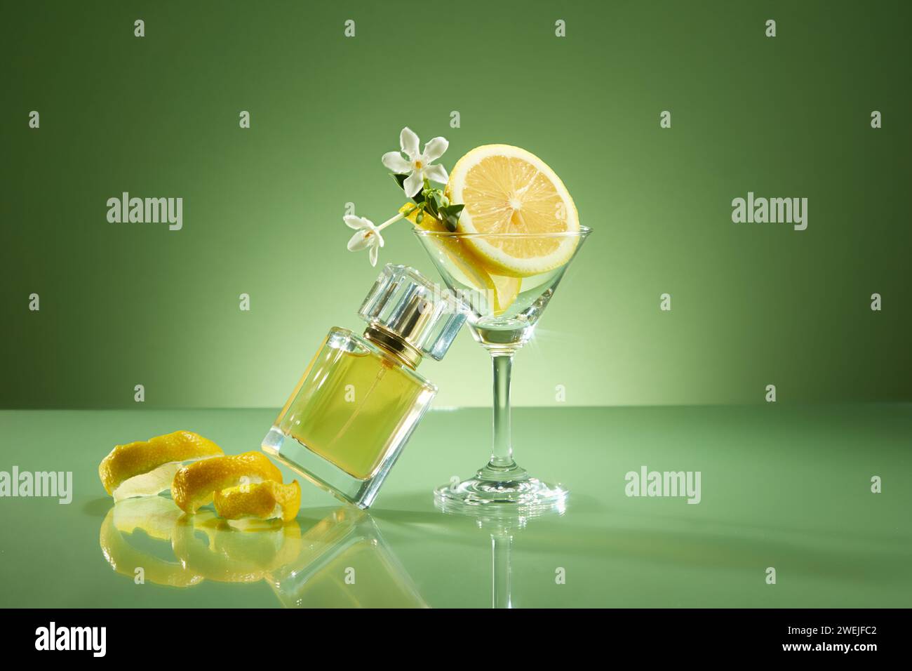 Perfume bottle prototype without label, slice and peel of lemon and ...