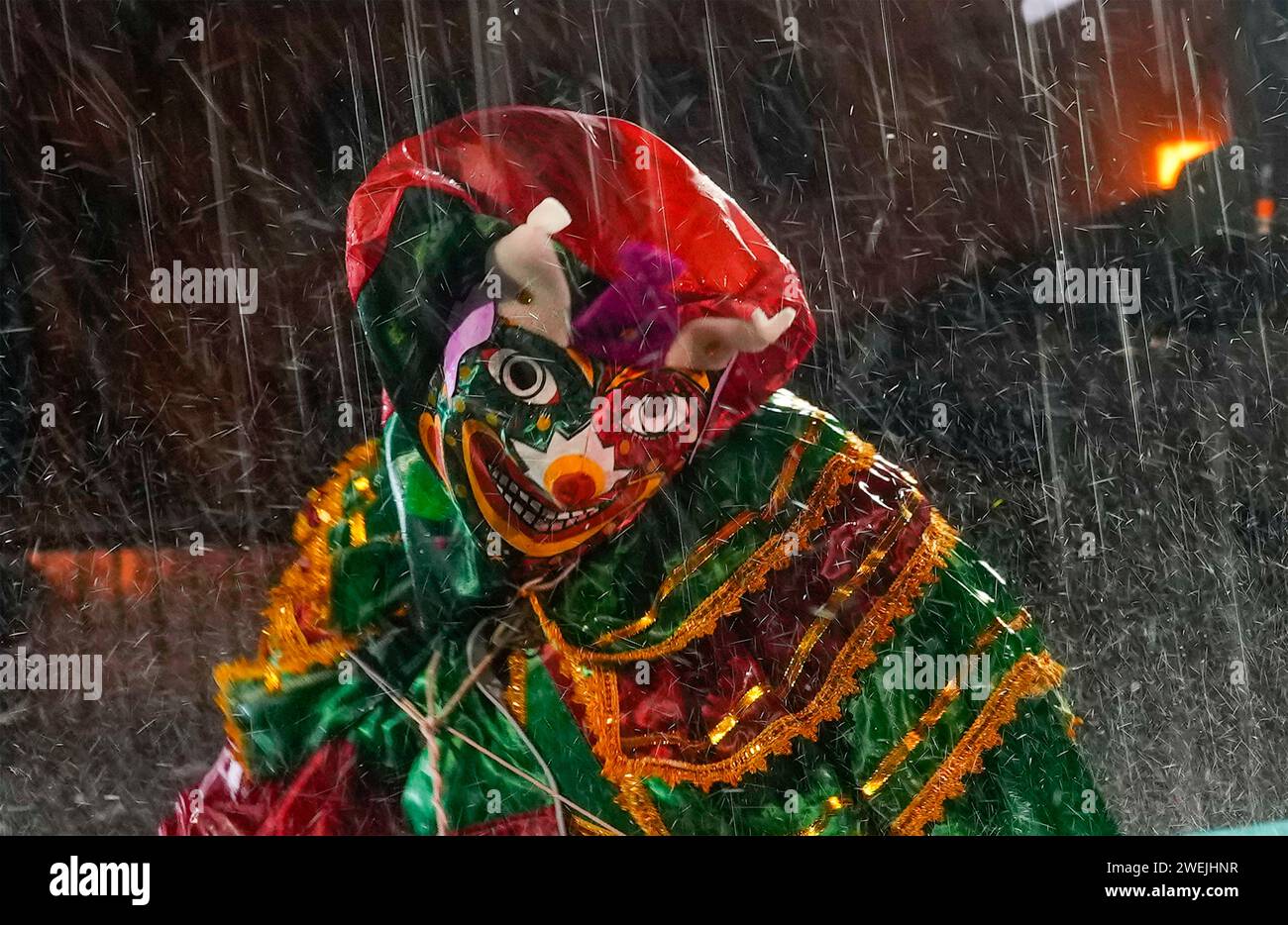 A contestant dressed as the Carnival character Pepino shows off his ...