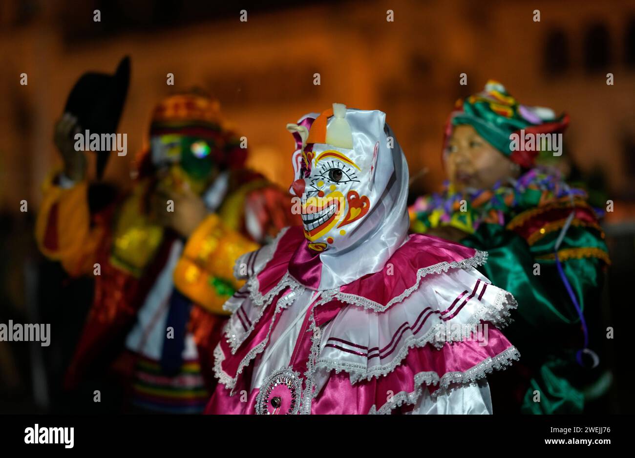 A contestant dressed as the Carnival character Pepino waits for the ...
