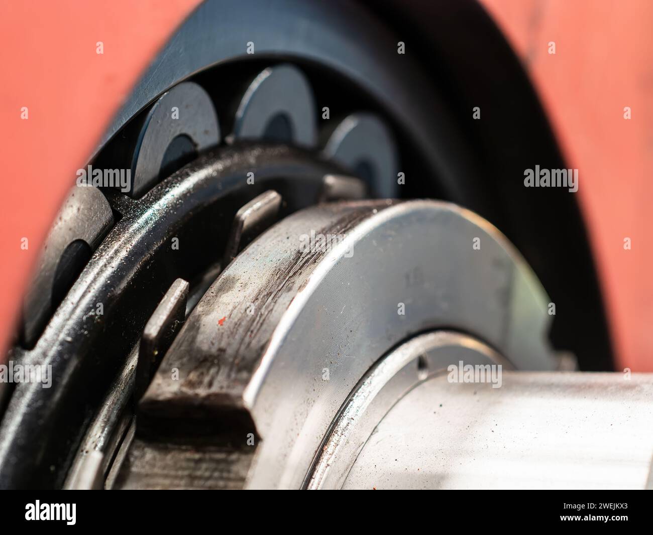 Closeup of heavy duty roller bearing and drive shaft on industrial ...