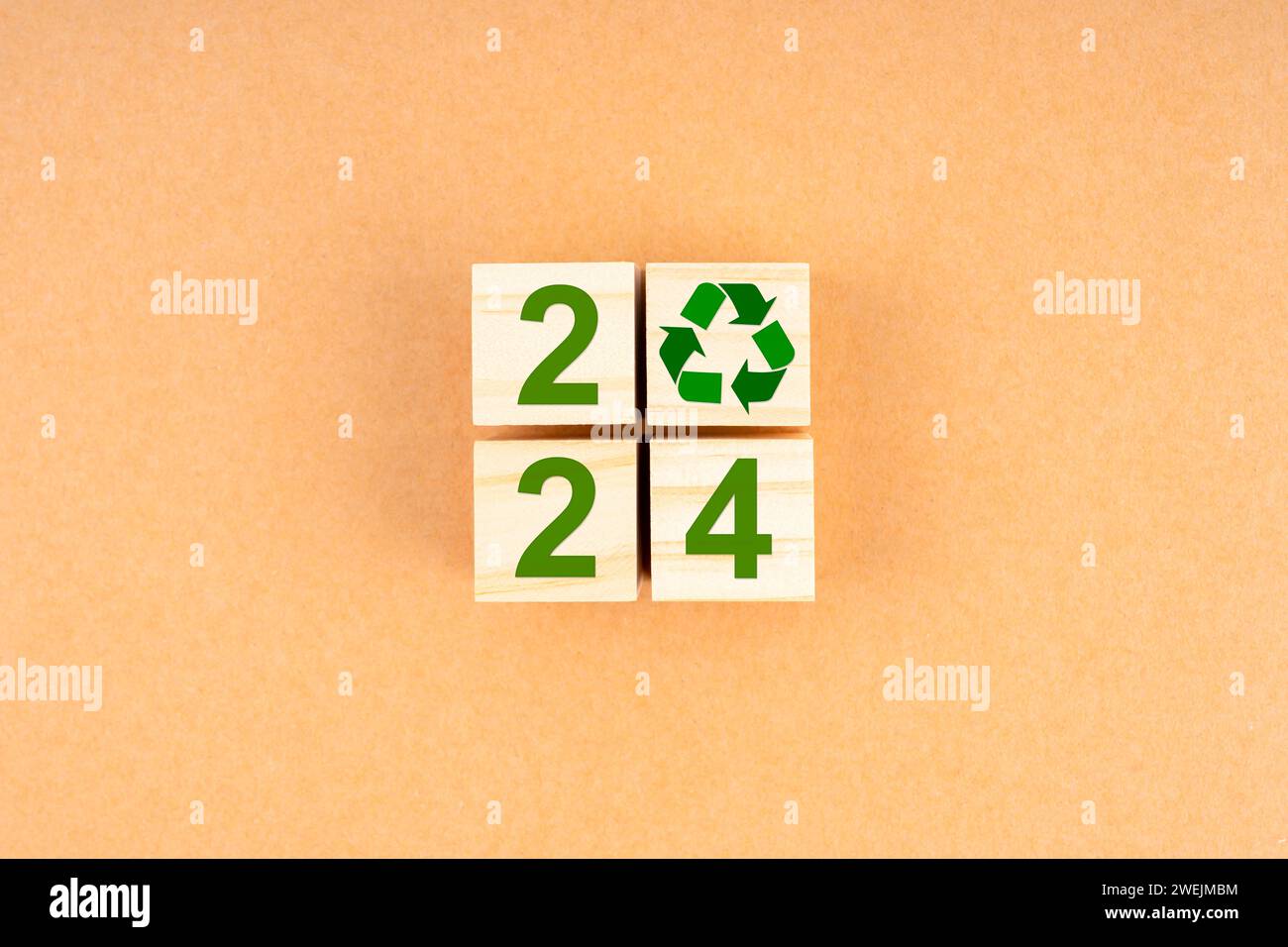 2024 Numbers and recycle symbol on wooden cube. Environmental ...