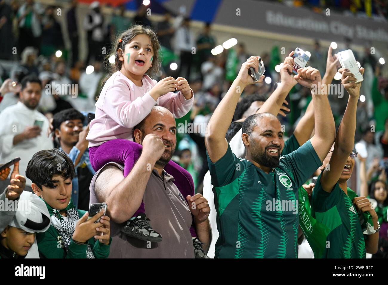 Doha, Qatar. 25th Jan, 2024. Fans cheer for team Saudi Arabia during ...