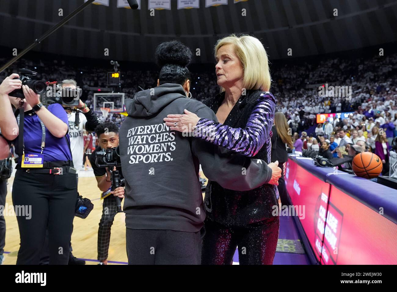 LSU head coach Kim Mulkey, facing, greets South Carolina head coach ...