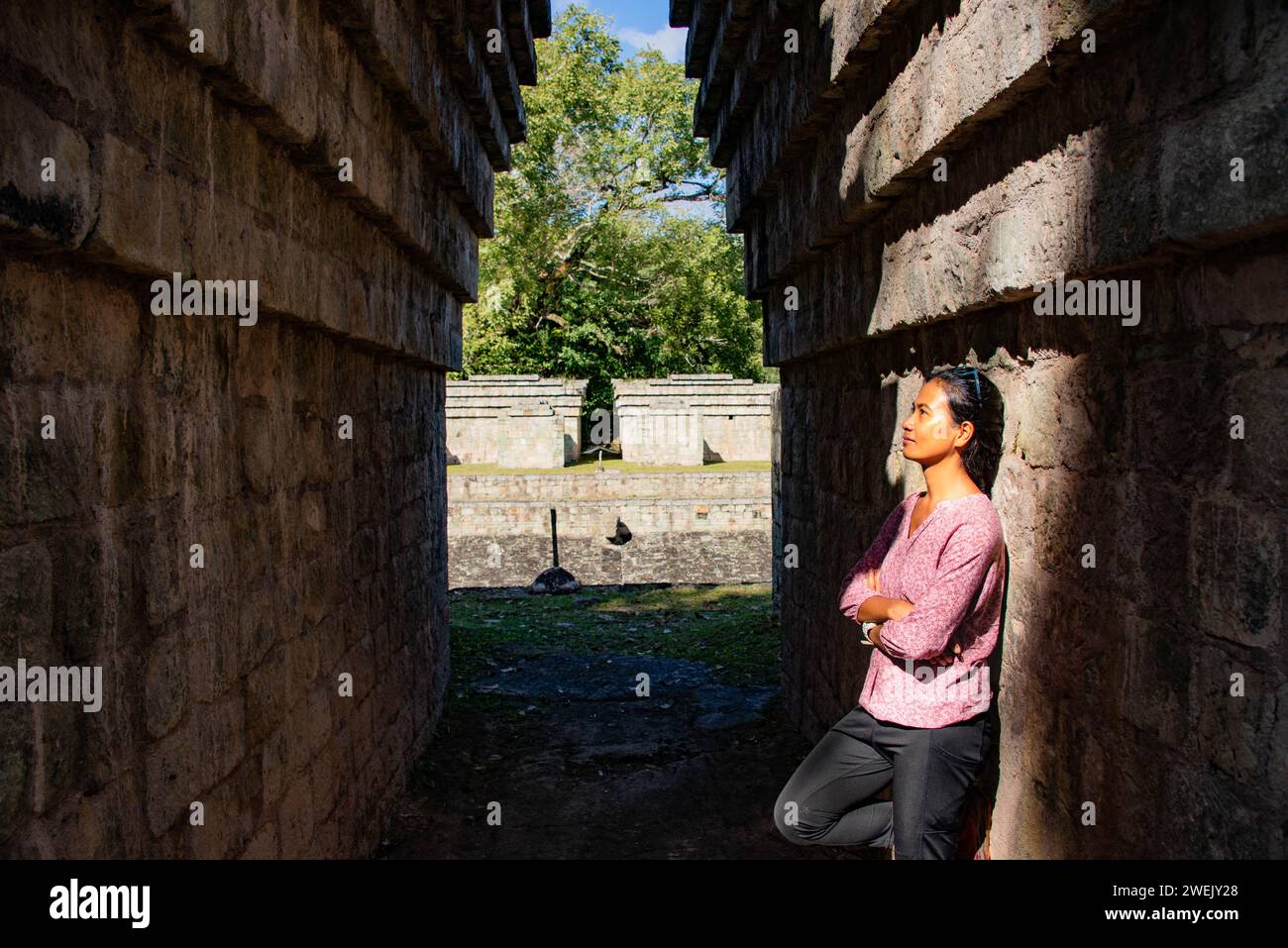 Tourist on the Ball Court at the Copan Mayan Ruins, Copan Ruinas ...