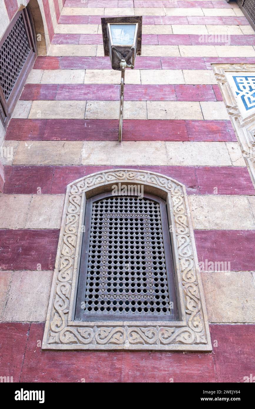 Rustic charm of Mamluk architecture weathered arched wooden window with ...