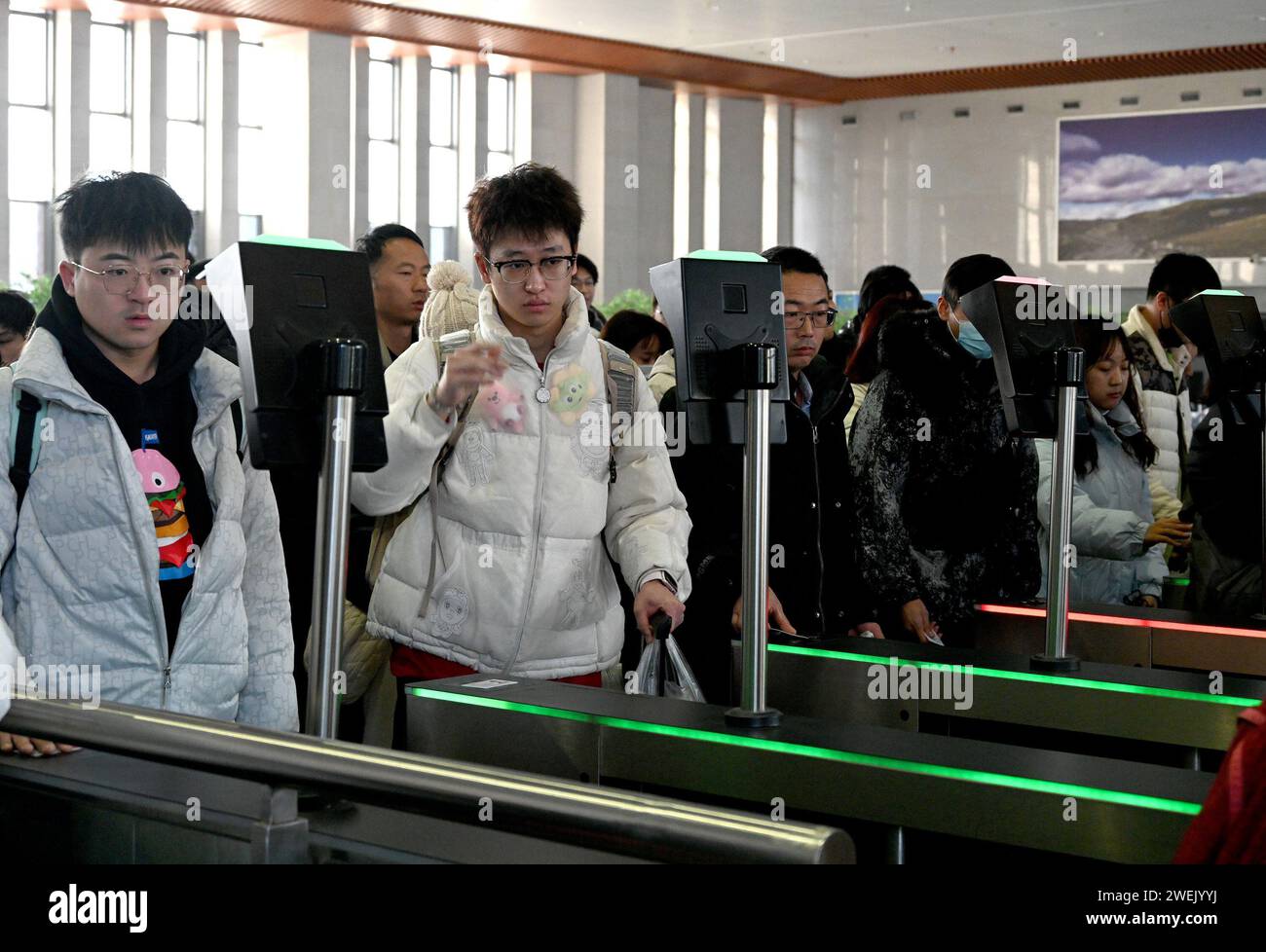 HANDAN, CHINA - JANUARY 26, 2024 - Passengers check their tickets at ...