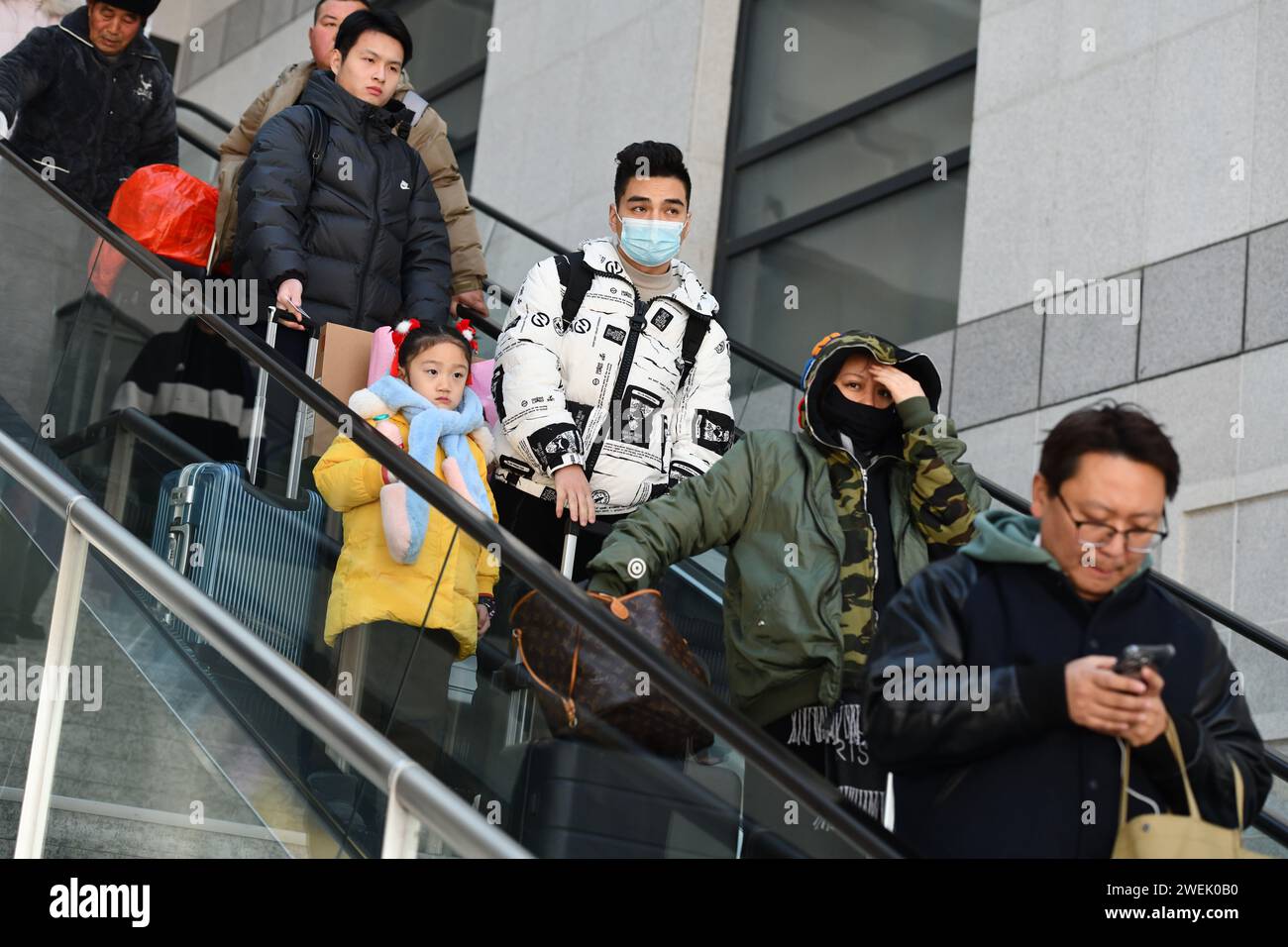 FUYANG, CHINA - JANUARY 26, 2024 - Passengers prepare to board a high ...