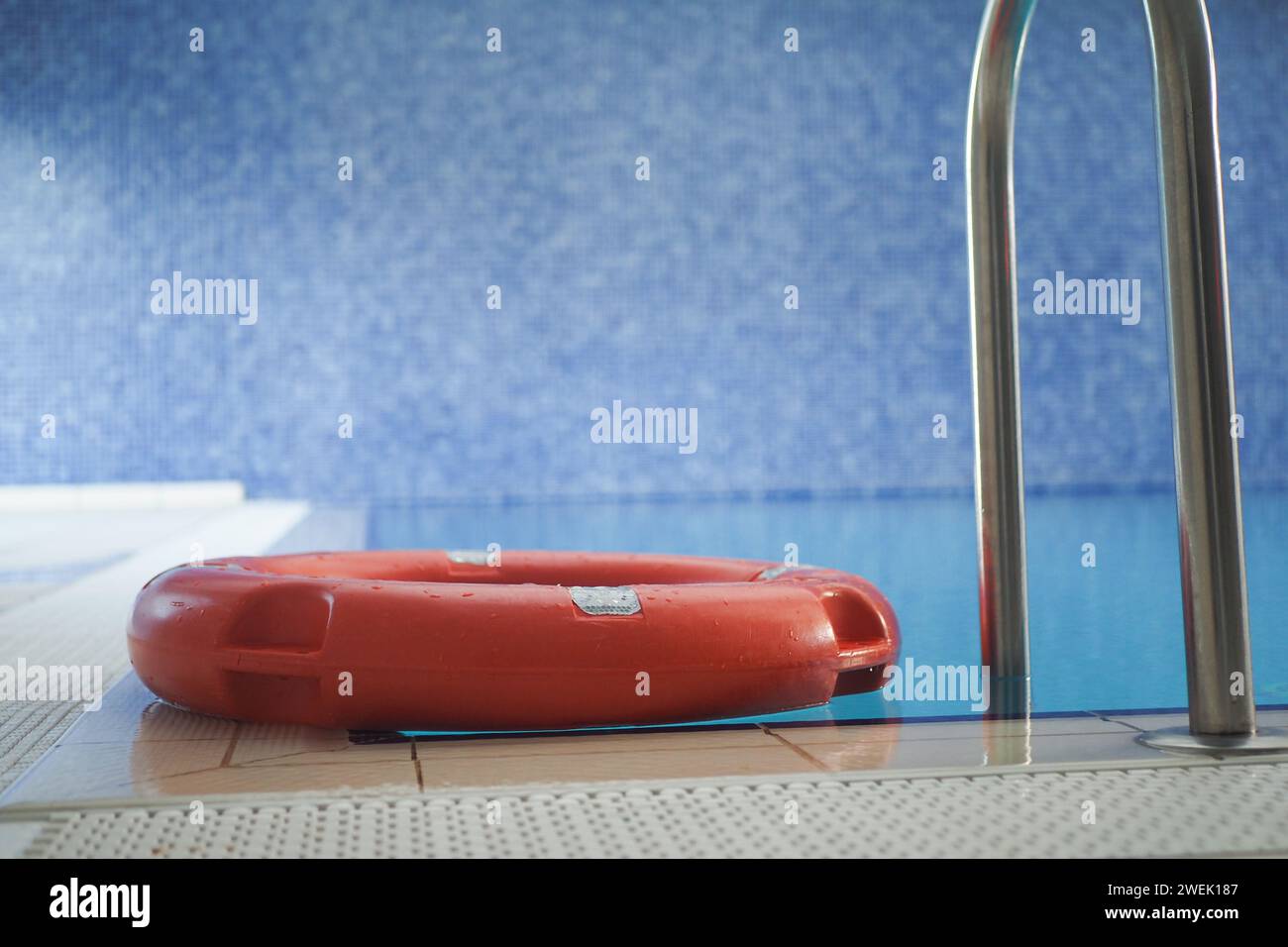 Red life buoy in swimming pool.. Help and support concept Stock Photo ...