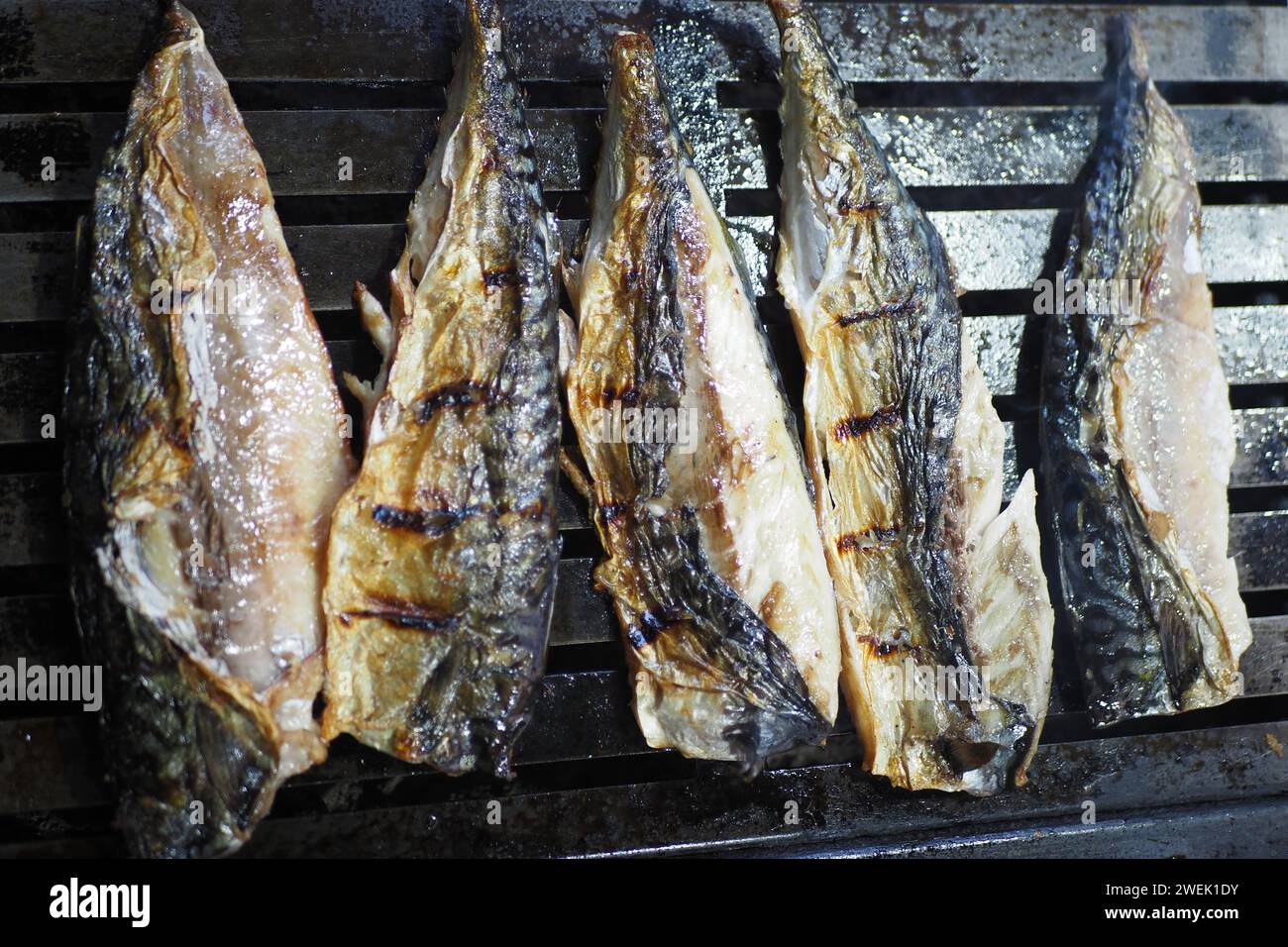 Baking and roasting fish on barbecue grill Stock Photo - Alamy