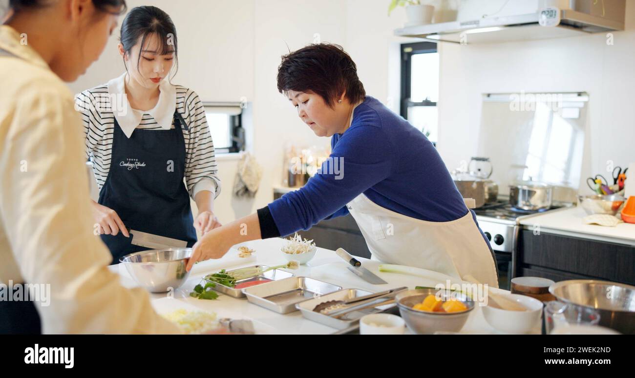 Japanese chef, women and cooking school with teaching, advice and knife for vegetables ...