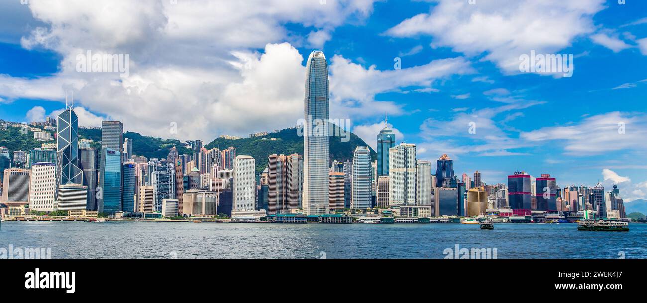 Panoramic view of the Hong Kong skyline from across the bay on a bright ...