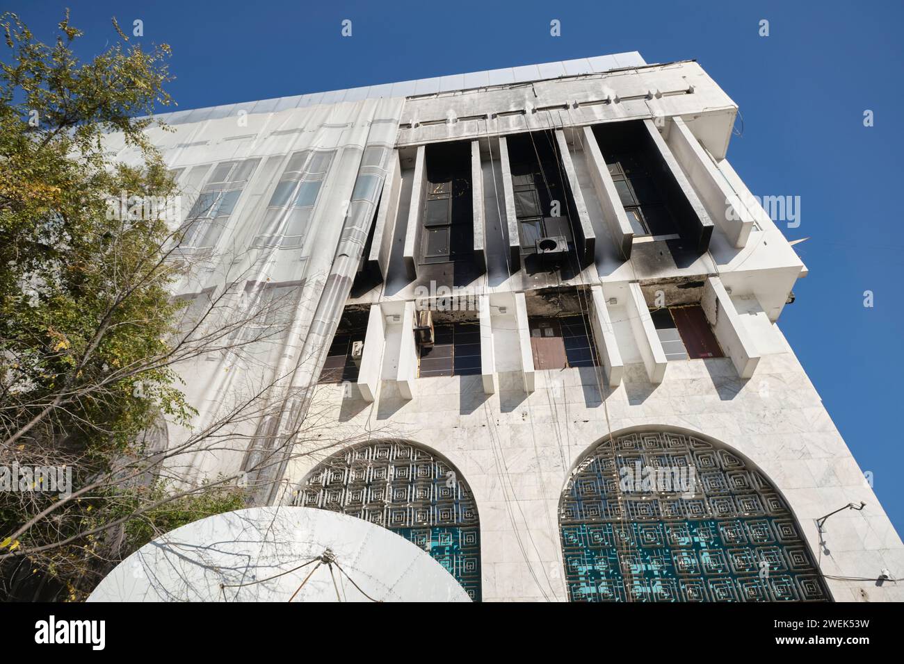 Detail of a burned out, damaged building in Republic Square. The fire ...