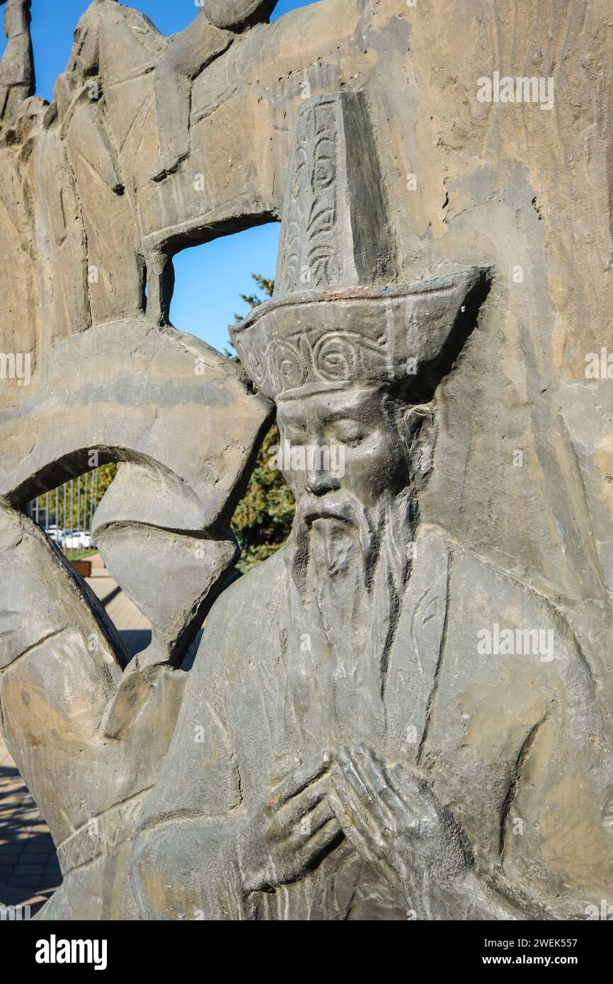 An ancient, traditional old man with topi, part of the bronze ...