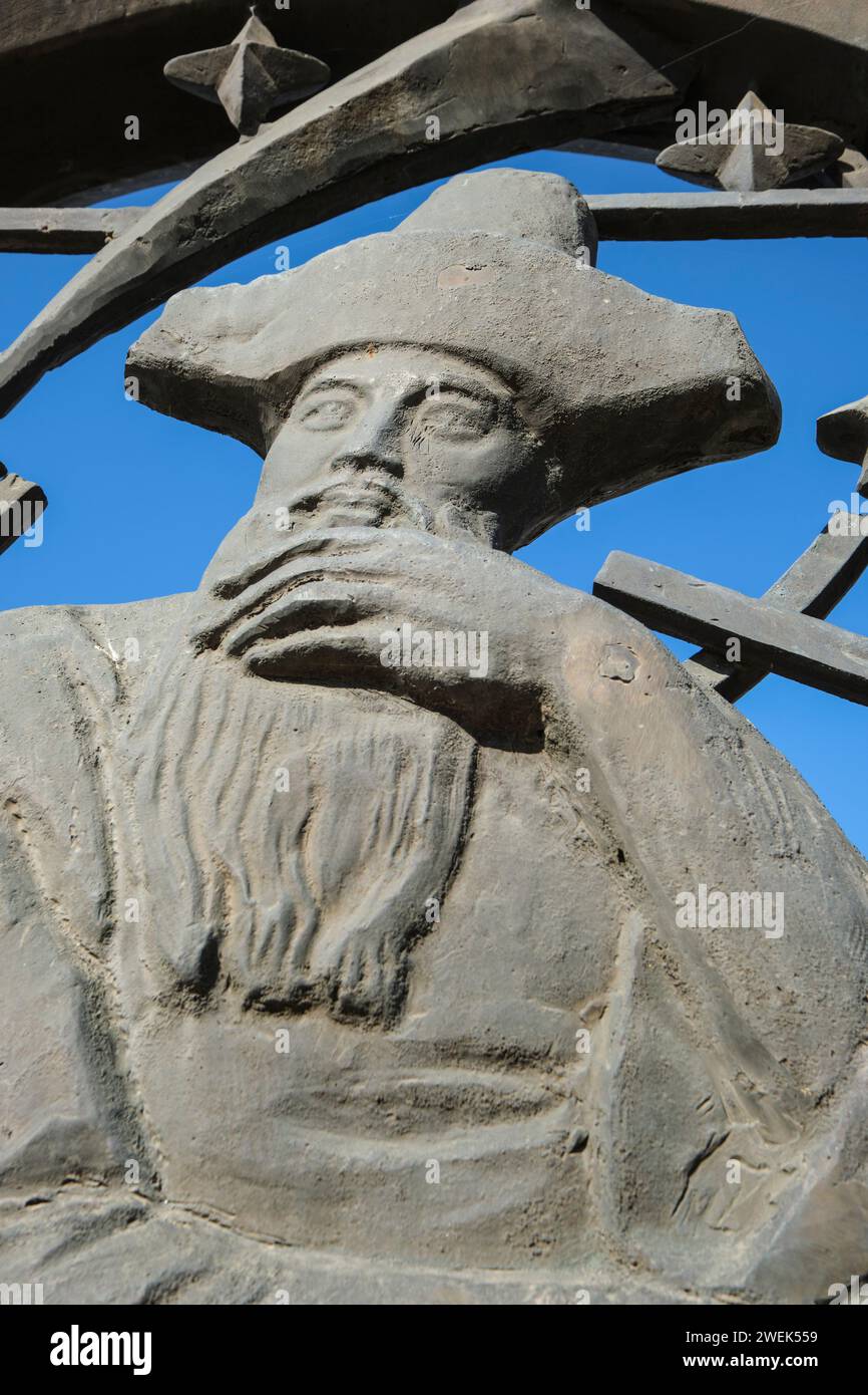 An ancient, traditional old man, part of the bronze historical frieze ...