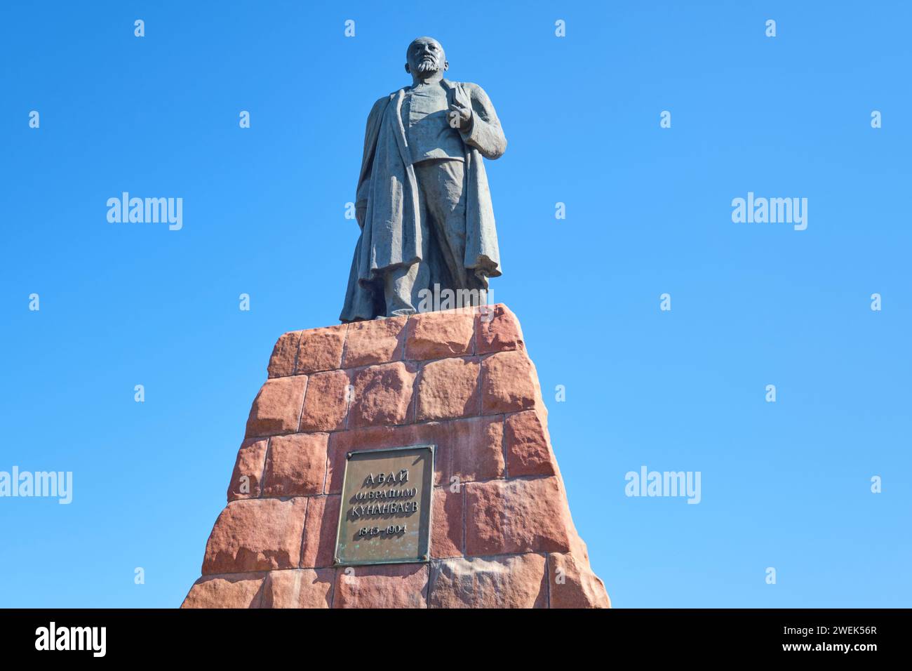 A statue of the famous poet, Abai, on a stone pedestal in the plaza in ...