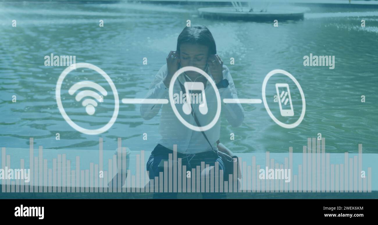 Digital icons and music equalizer against woman wearing earphones ...