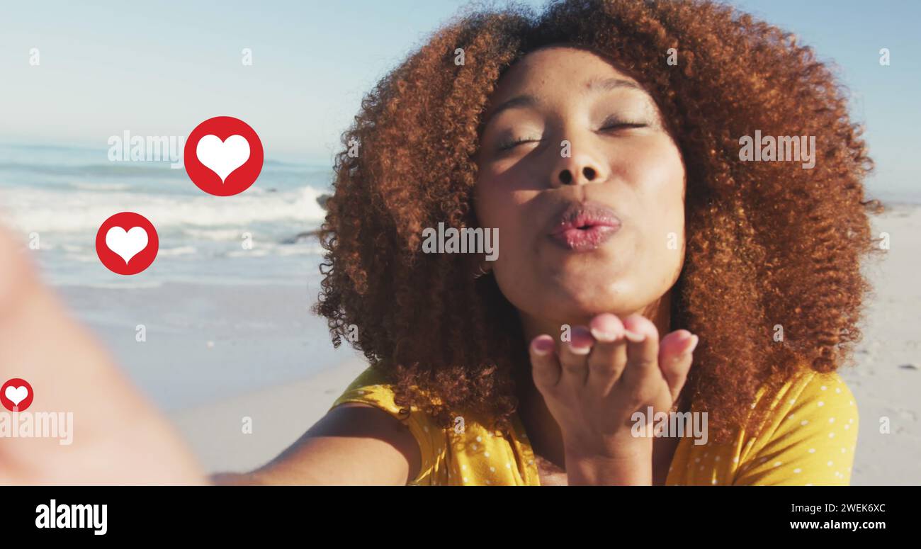 Woman blowing kisses on the beach hi-res stock photography and images ...