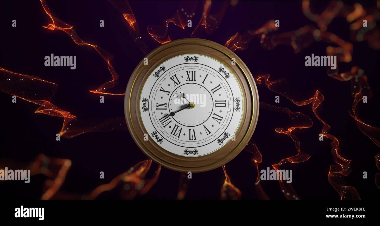 Image of clock ticking over light trails on black background Stock ...