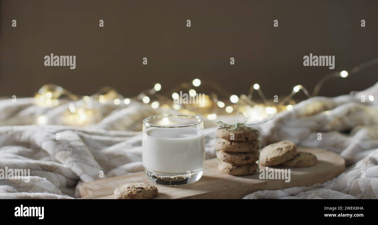 A glass of milk and cookies on a cozy bed setup, with copy space Stock ...