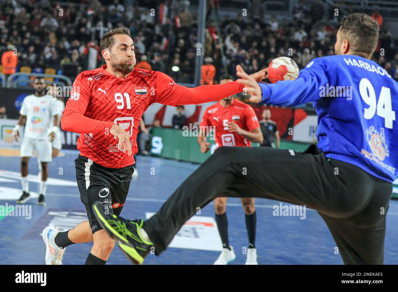 Cairo, Egypt. 25th Jan, 2024. Mohammad Sanad (L) of Egypt competes ...