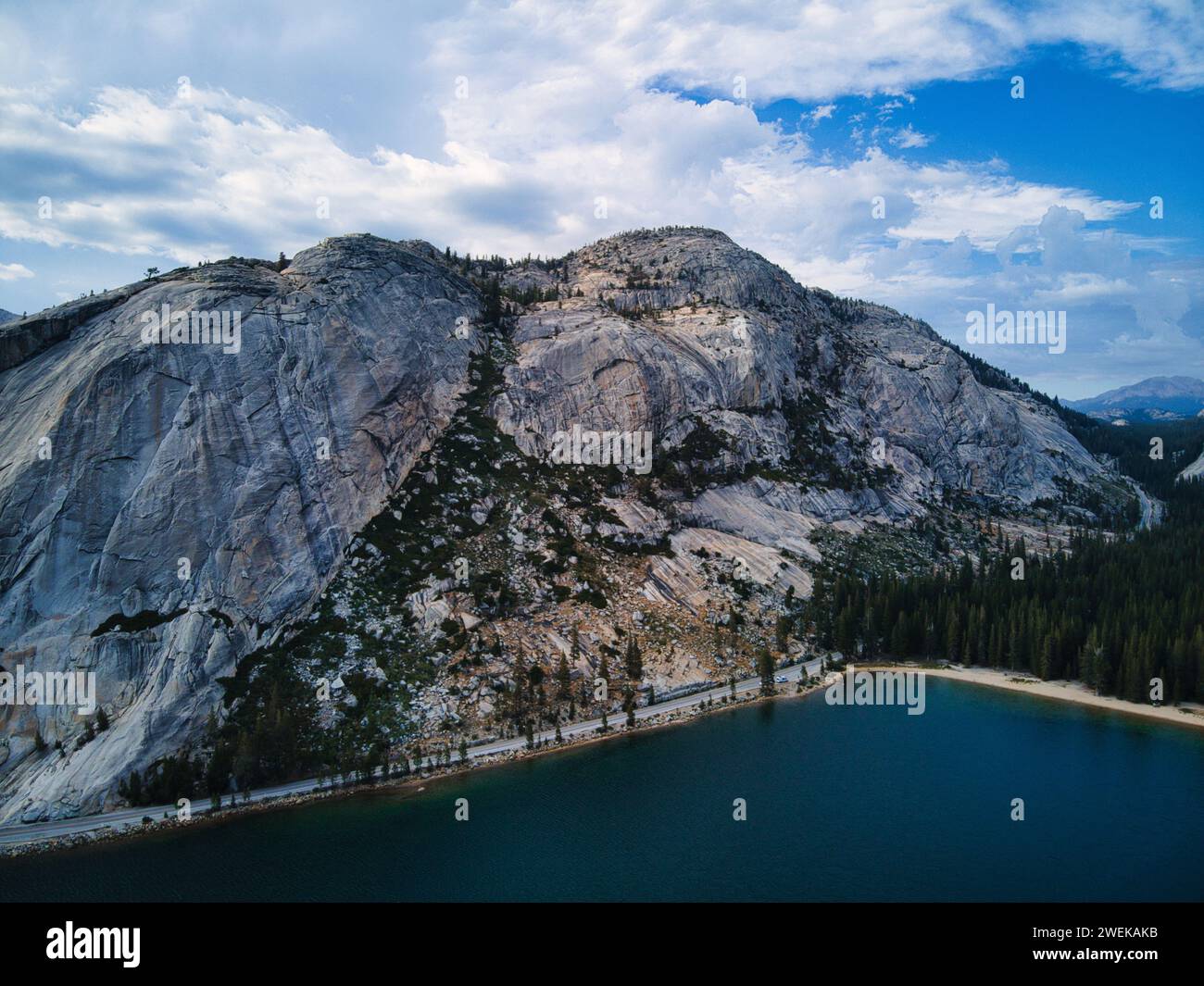 Mountain peak with expansive lake nestled between two majestic peaks ...