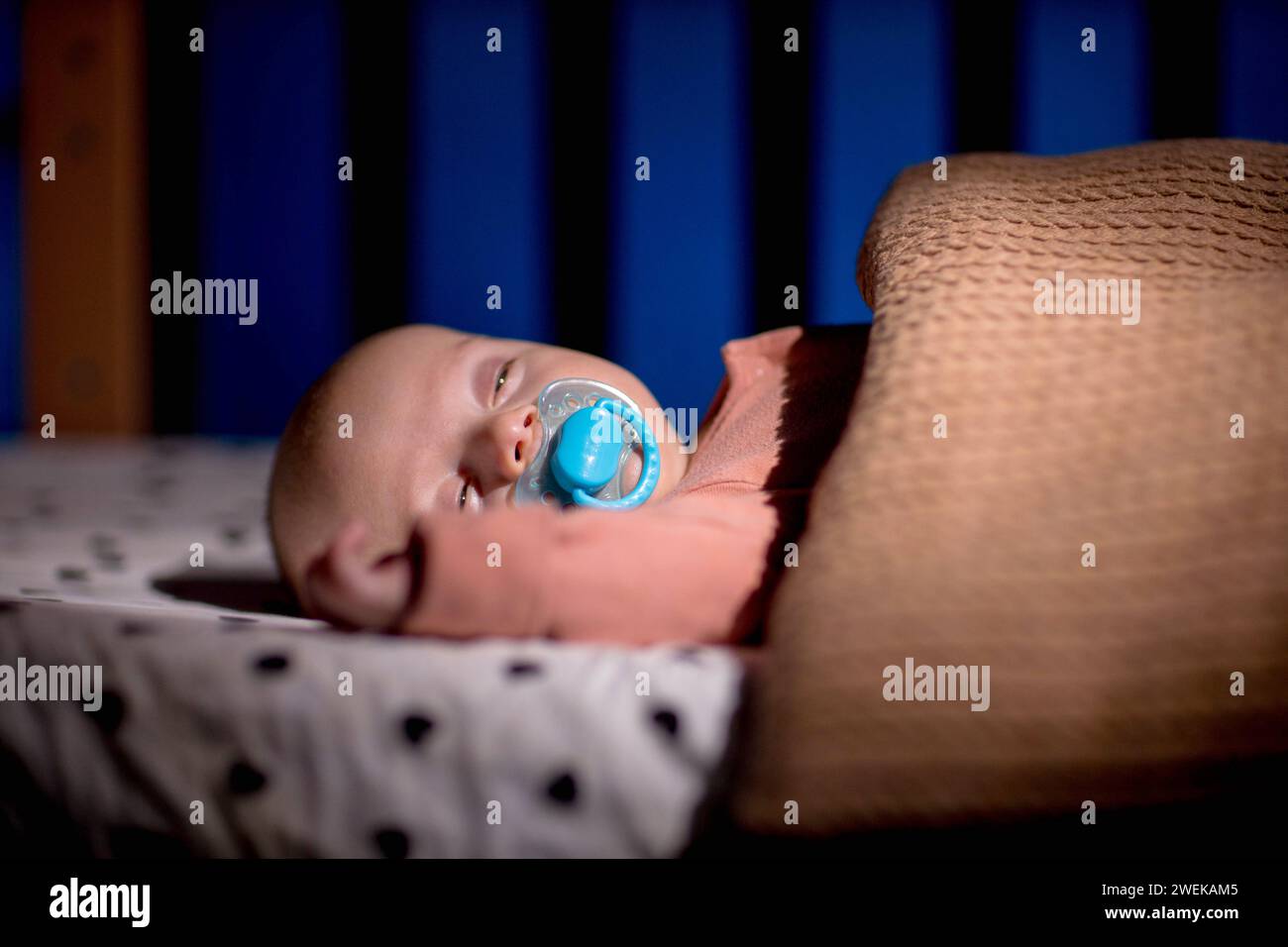 Cute little baby sleeping in cradle at home night Stock Photo - Alamy