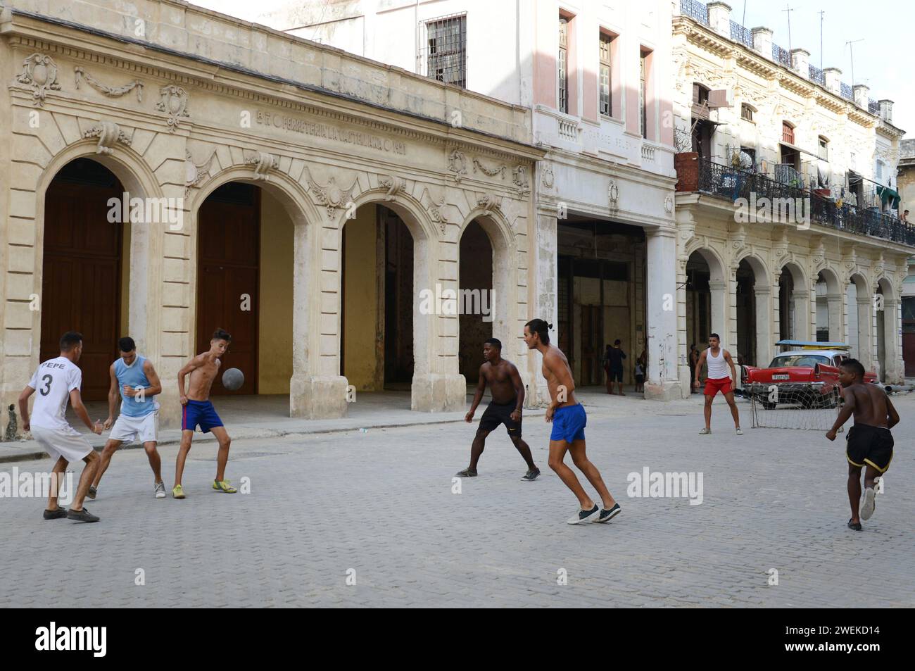 Cuban men playing football in the streets of old Havana, Cuba Stock ...