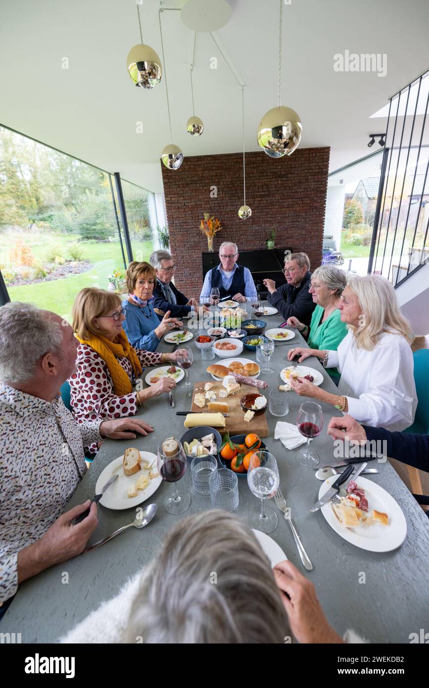 This heartening image features a group of seniors gathered around a ...