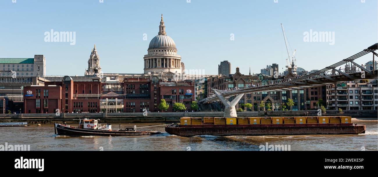 LONDON, UK - MAY 24, 2010: Panorama view of tug Towing cargo Barge ...