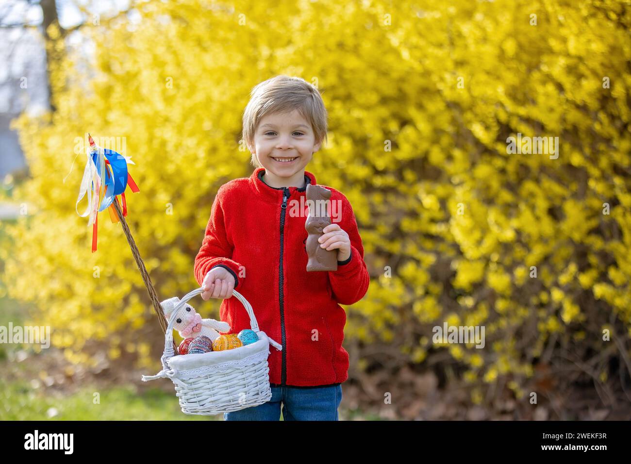 Cute preschool child, boy, holding handmade braided whip made from ...