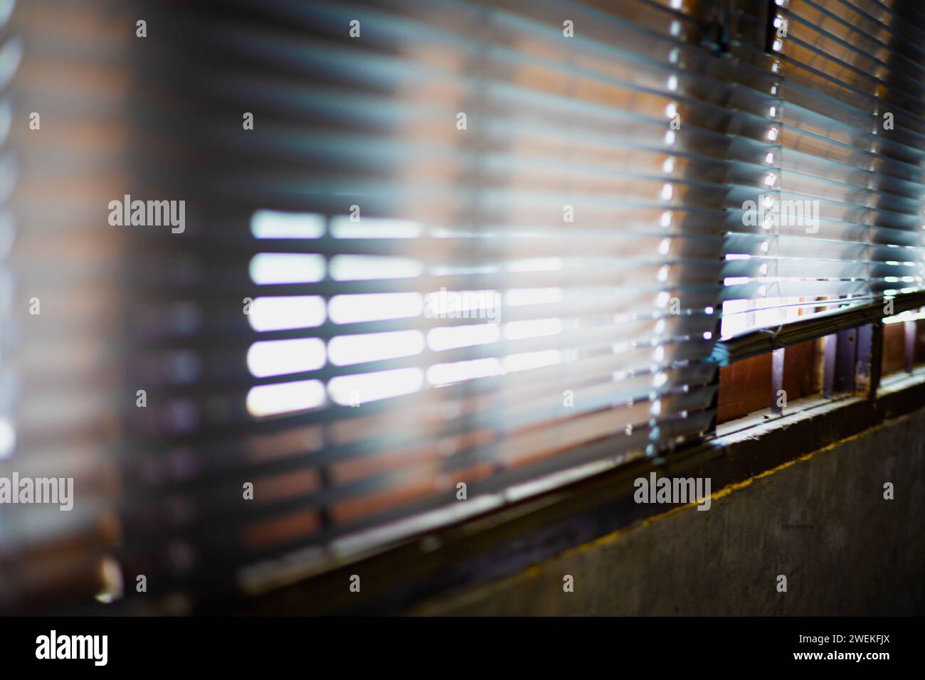 The sun shines through the window. Modern blind curtain close up Stock ...