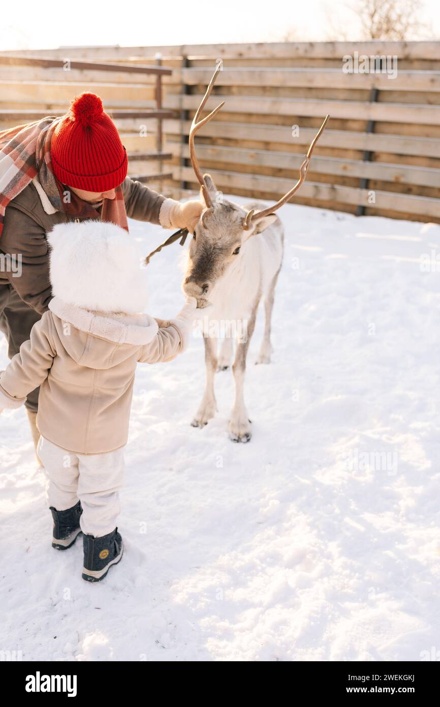 Vertical rear view of happy family of father and little child daughter ...