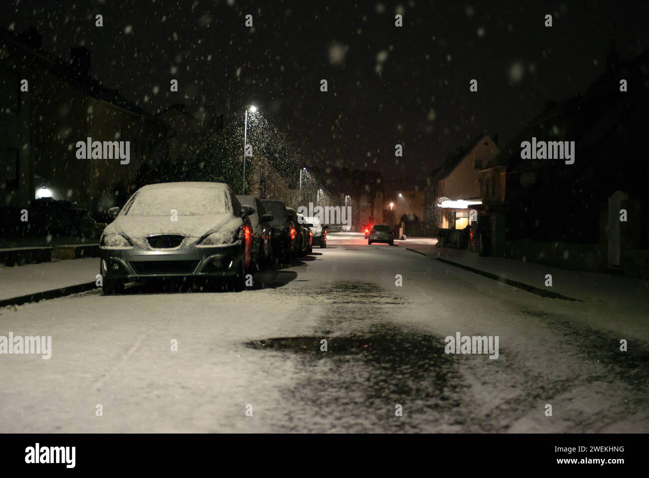 Blurred background. City view, lights, falling snow, night, street ...