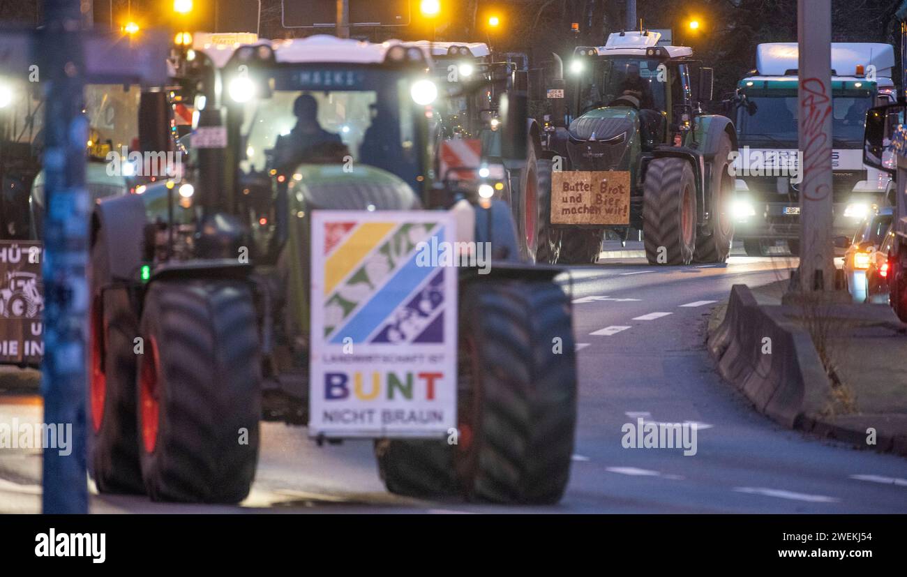 Rostock, Germany. 26th Jan, 2024. Tractors on a rally to Rostock pass ...