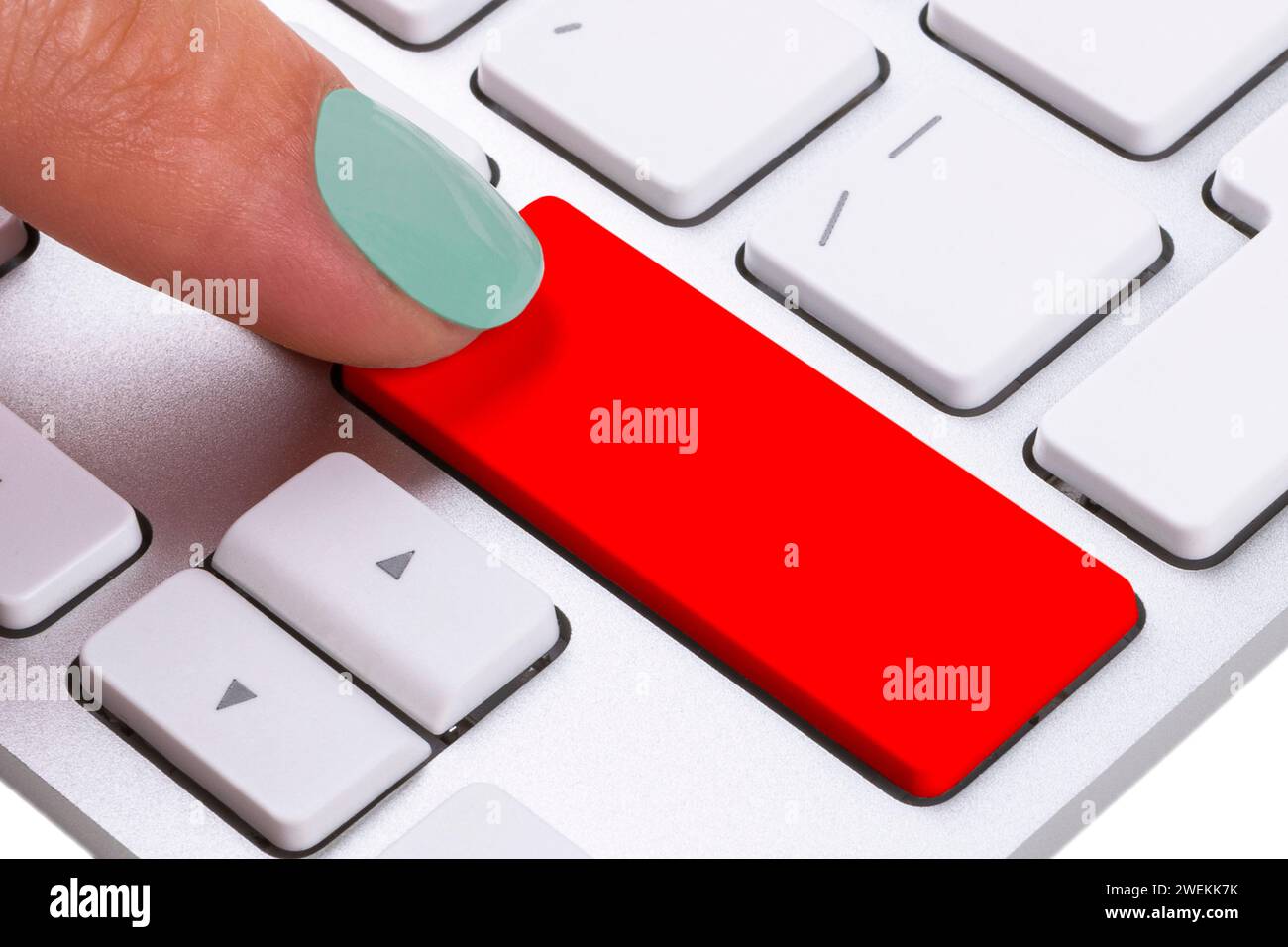 Close up view of a Finger Pushing on a red Button of computer Keyboard. Finger Pressing a Slim ...