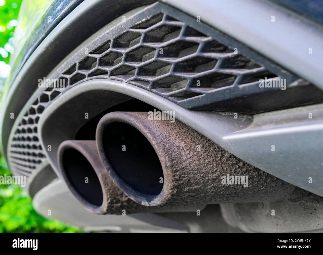 Close up of a car dual exhaust pipe. Double exhaust pipes of a modern ...