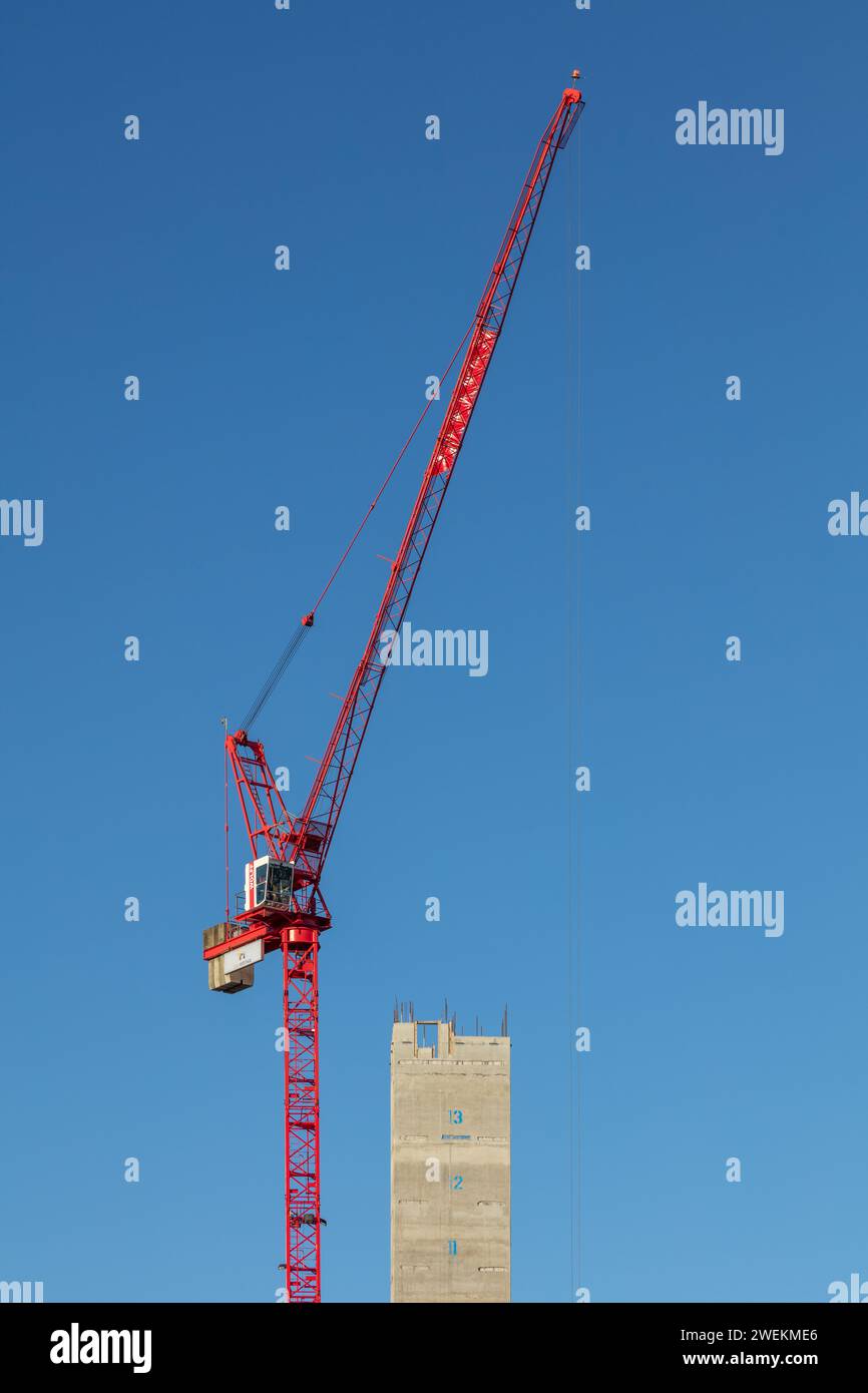 Portrait image of the concrete core tower & tower crane on a sunny day ...