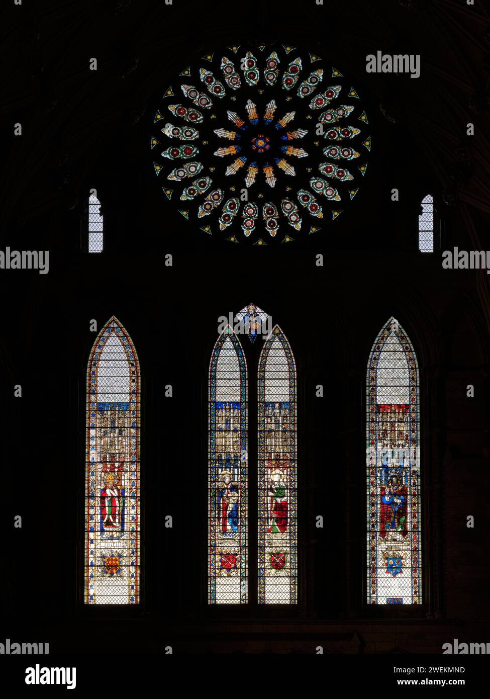 Rose stained glass window above four arched windows in the south ...