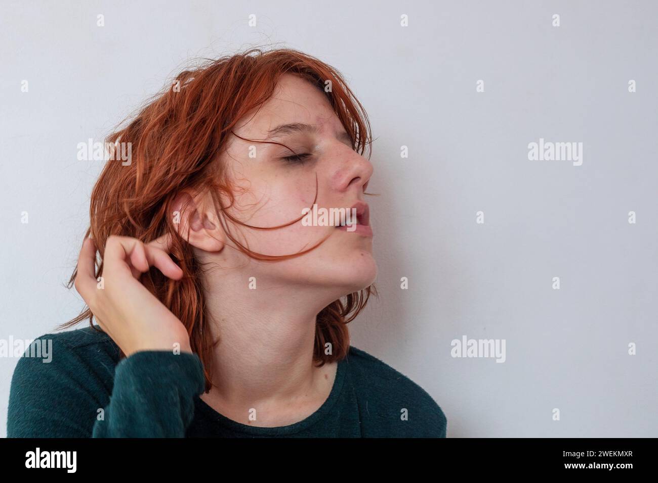 teenage girl with red hair is crying in her room. Emotion management ...