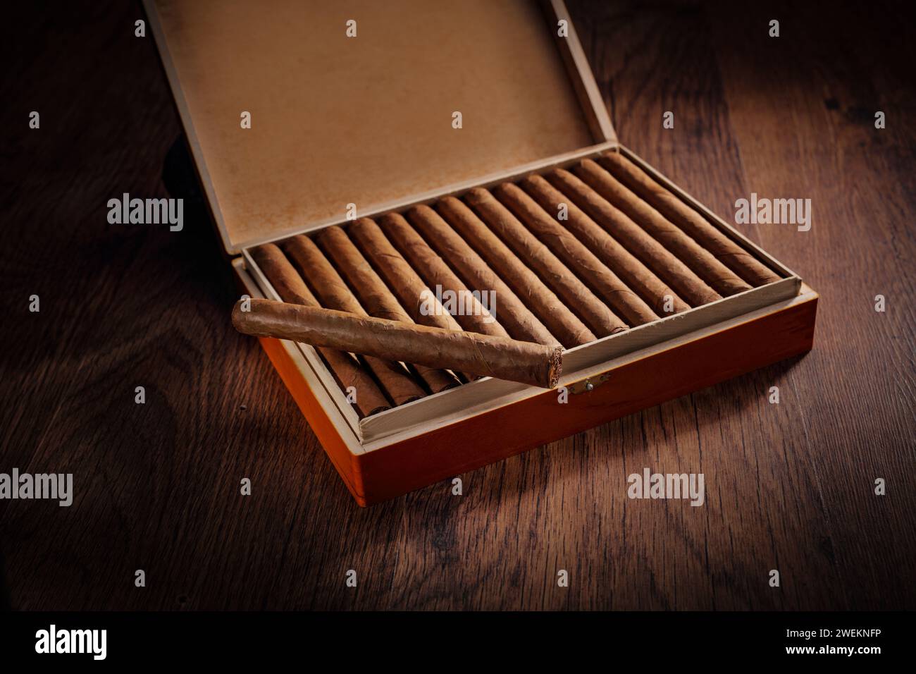 Box of cuban cigars on a dark brown wooden floor Stock Photo - Alamy