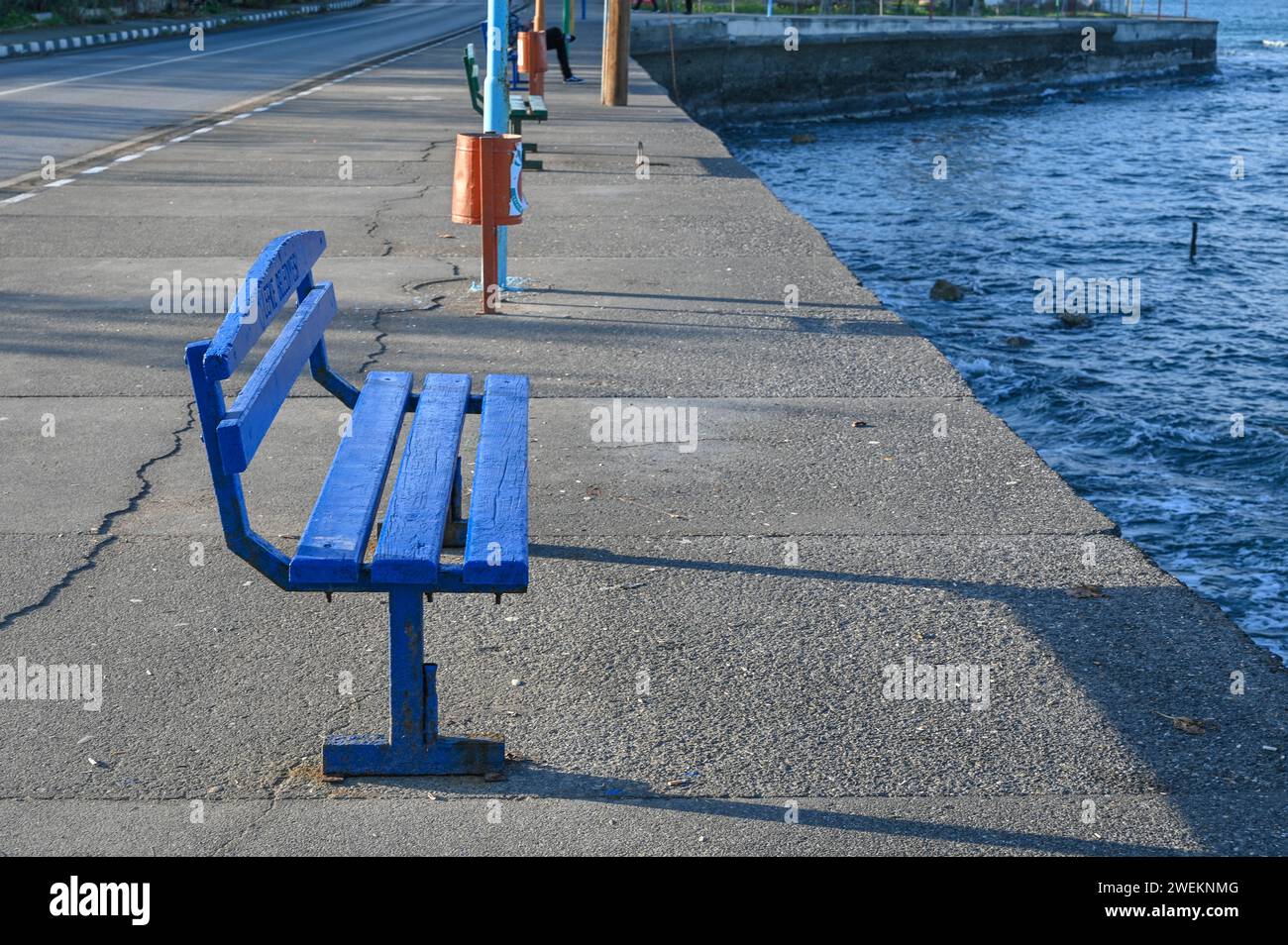 blue bench embankment in Cyprus Stock Photo - Alamy