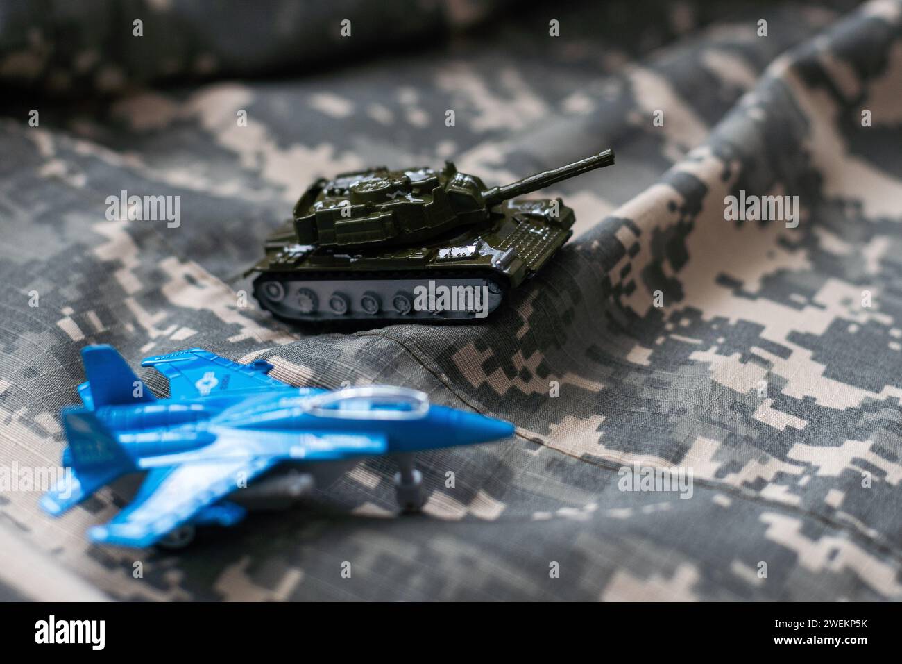 Toy tank with camouflage color . Military vehicles toy. Simple cheap ...