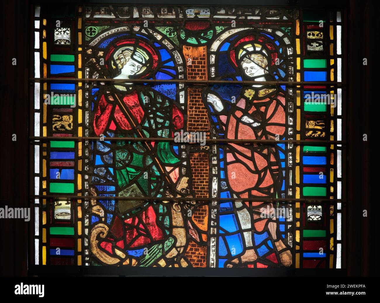 Medieval stained glass window, of St Geroge and the dragon opposite ...