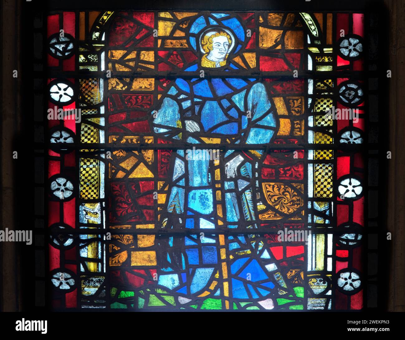 Medieval stained glass window, of a saint, in the cathedral at York ...
