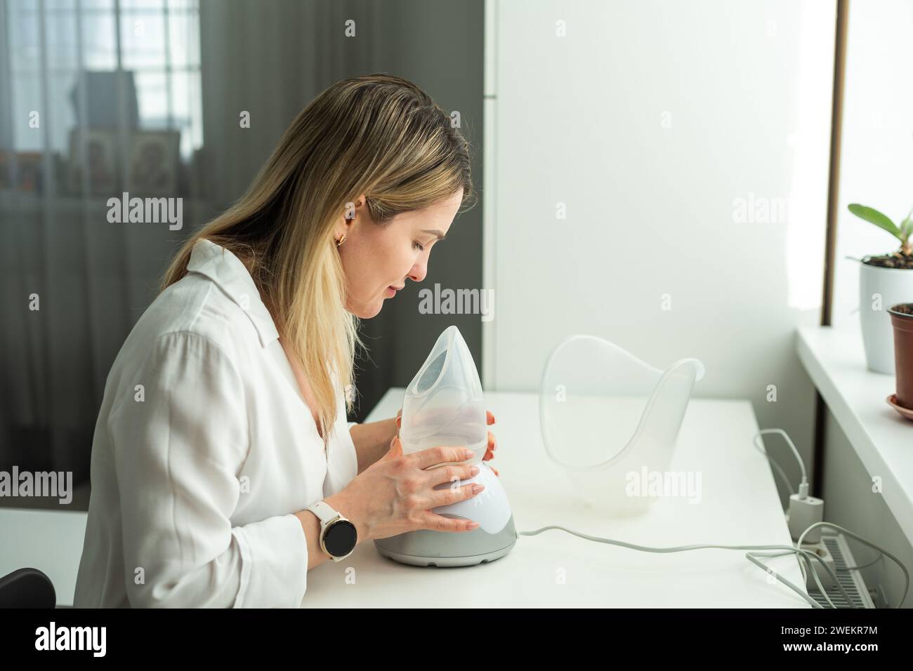 Woman has a bad cold and is trying therapy by inhaler Stock Photo - Alamy