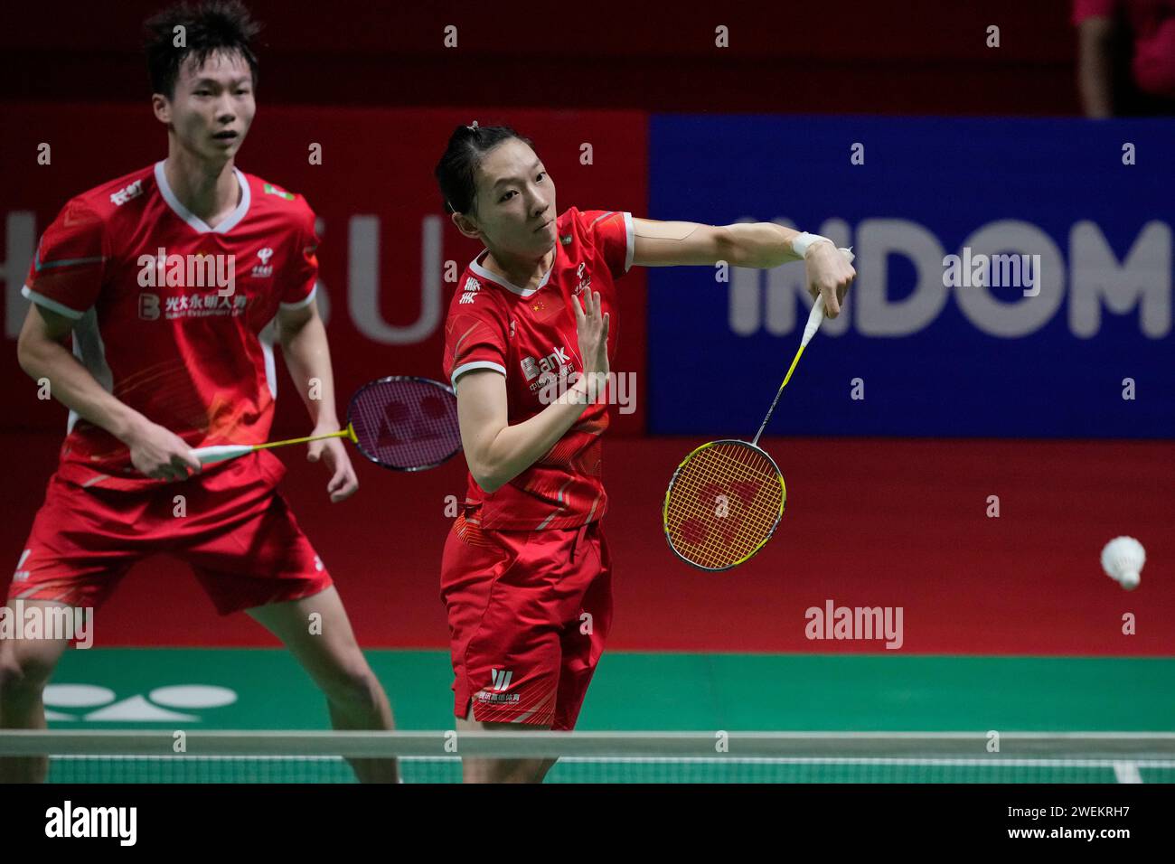 China's Wei Ya Xin, right, and Jiang Zhen Bang plays a shot to Japan's Natsu Saito and Hiroki ...